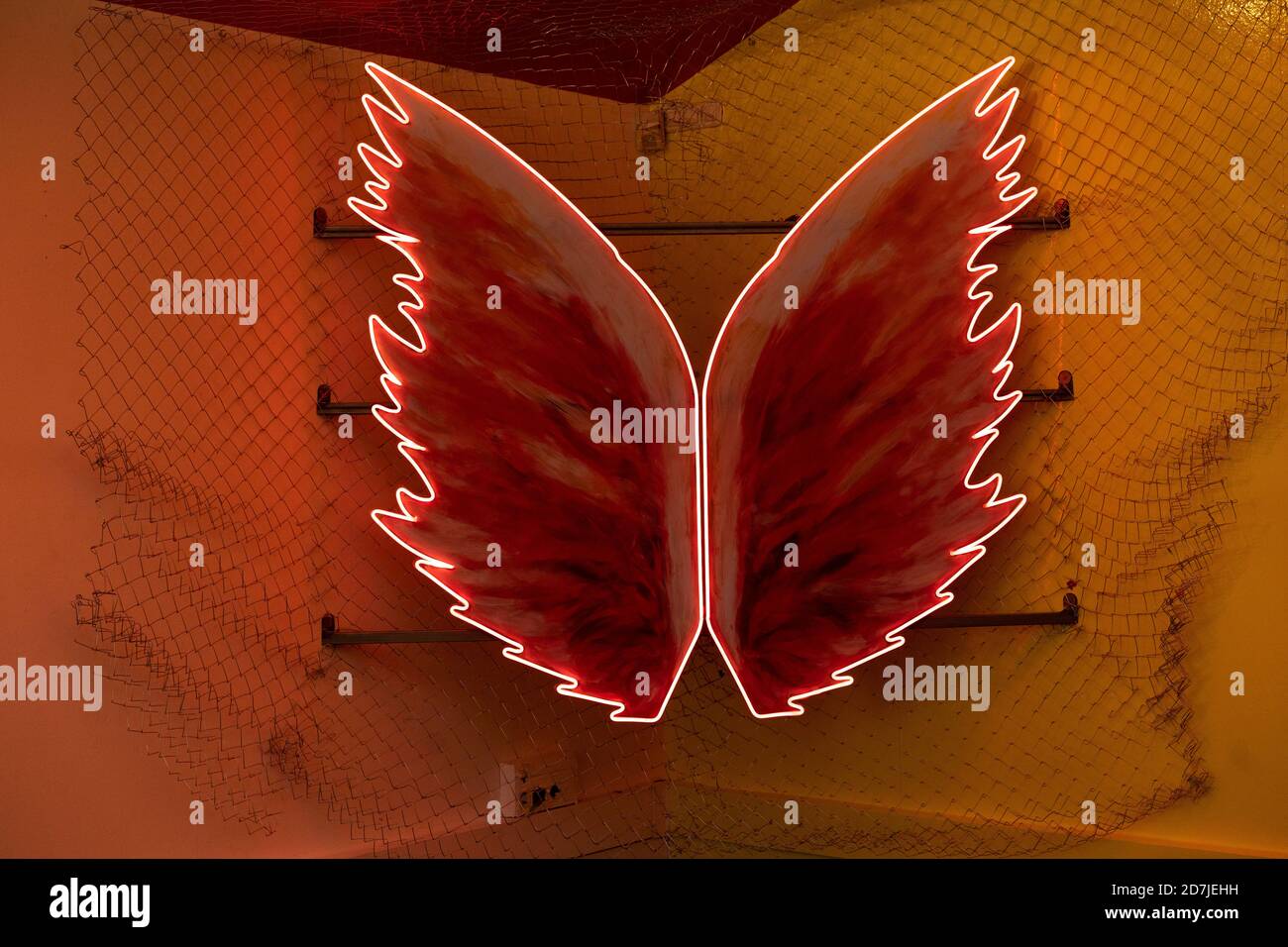 Red glowing neon wings Stock Photo - Alamy