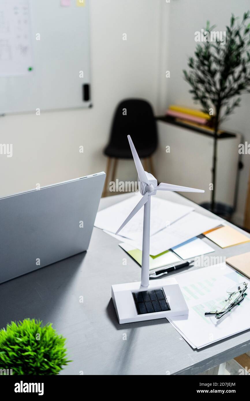 Wind turbine shaped electric fan standing on office desk Stock Photo ...