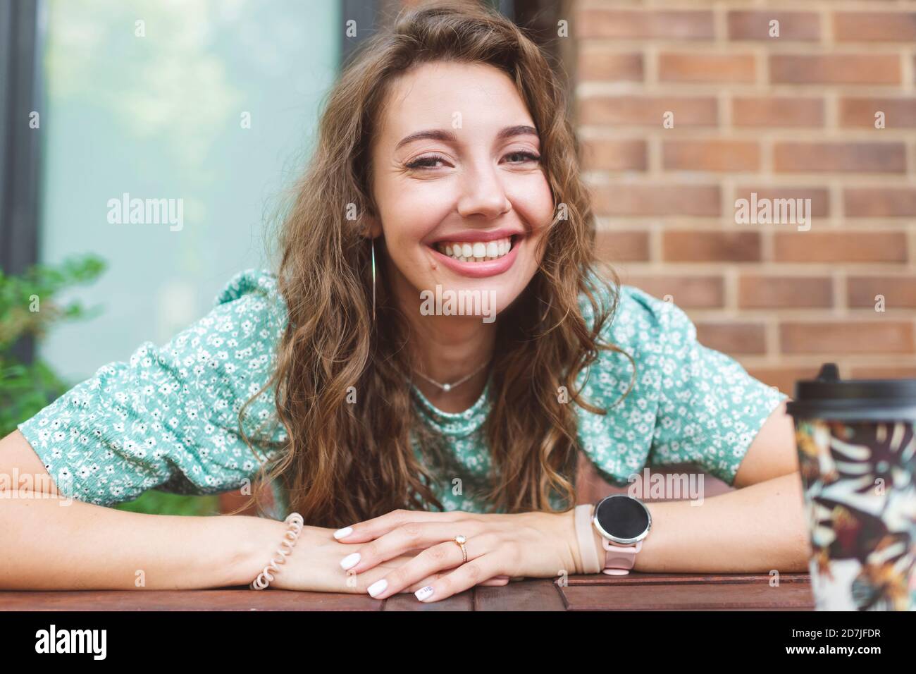 Beautiful woman sitting table hi-res stock photography and images - Alamy