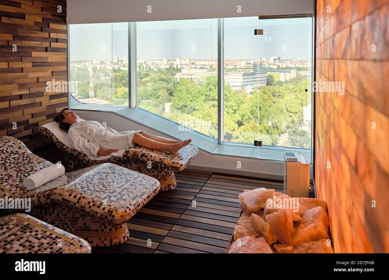 Woman lying on lounge chair hi-res stock photography and images - Alamy