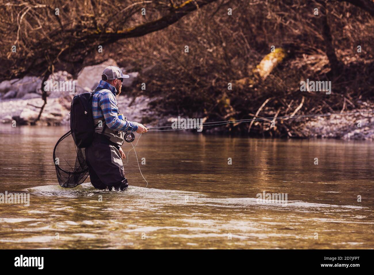 Fisherman in waders hi-res stock photography and images - Alamy