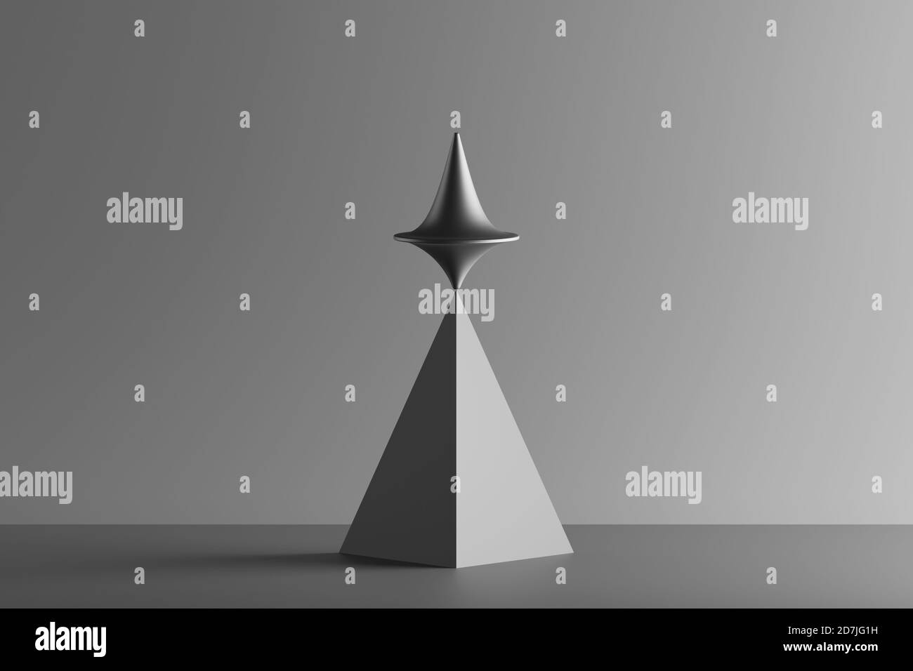 Three dimensional render of metallic top spinning on top of geometric ...