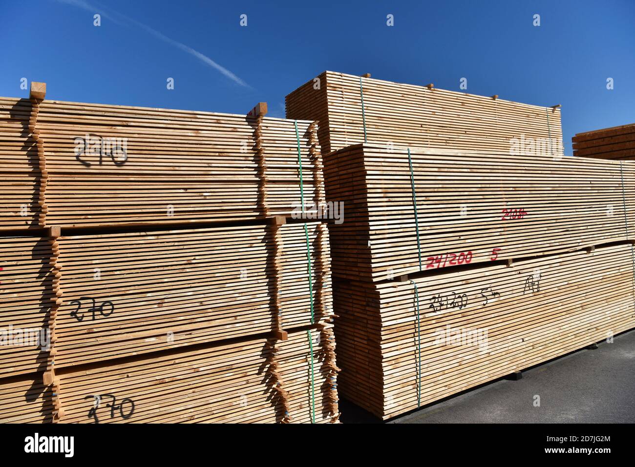Planks stacked in lumberyard Stock Photo - Alamy