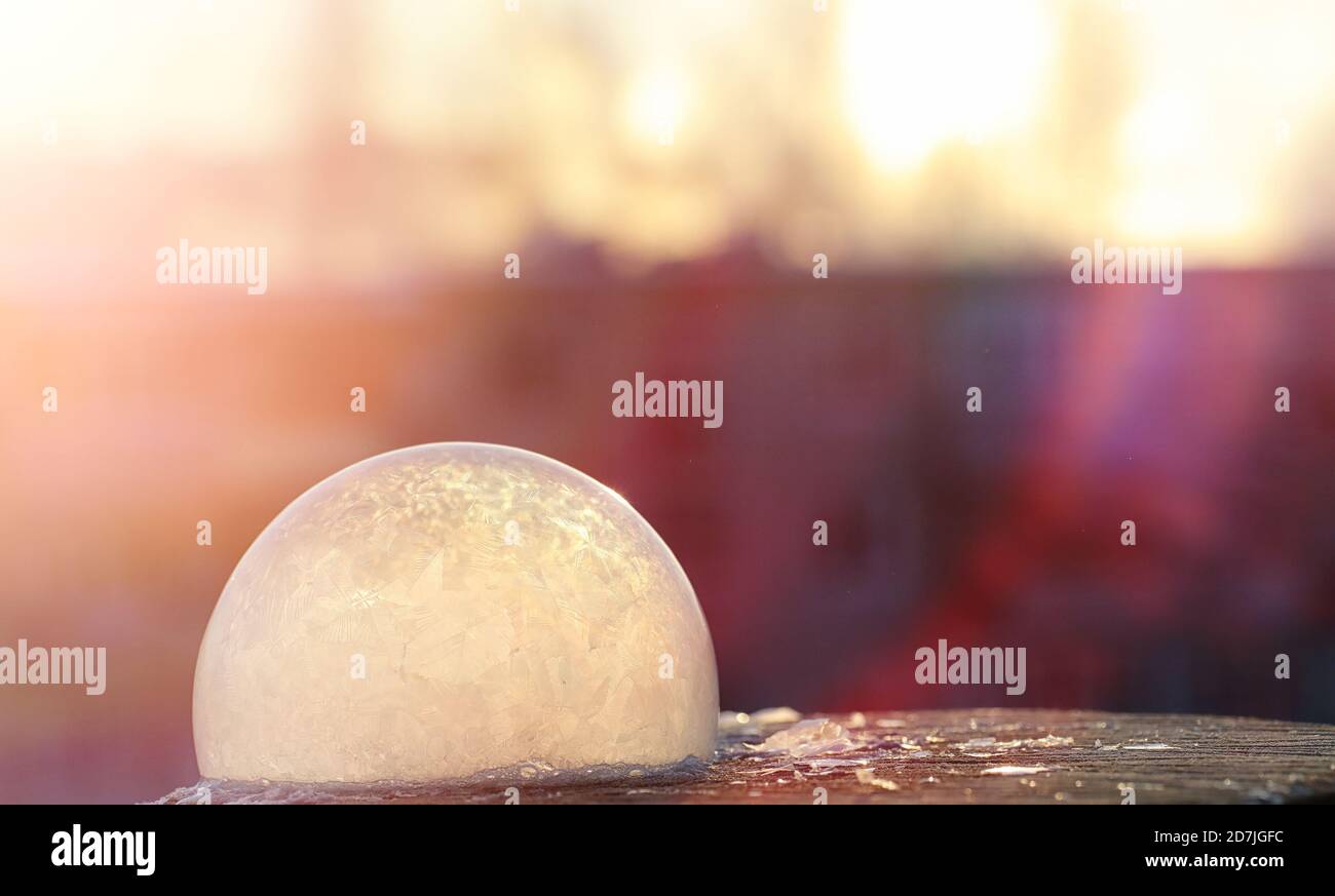 Soap bubbles freeze in the cold. Winter soapy water freezes in the air ...