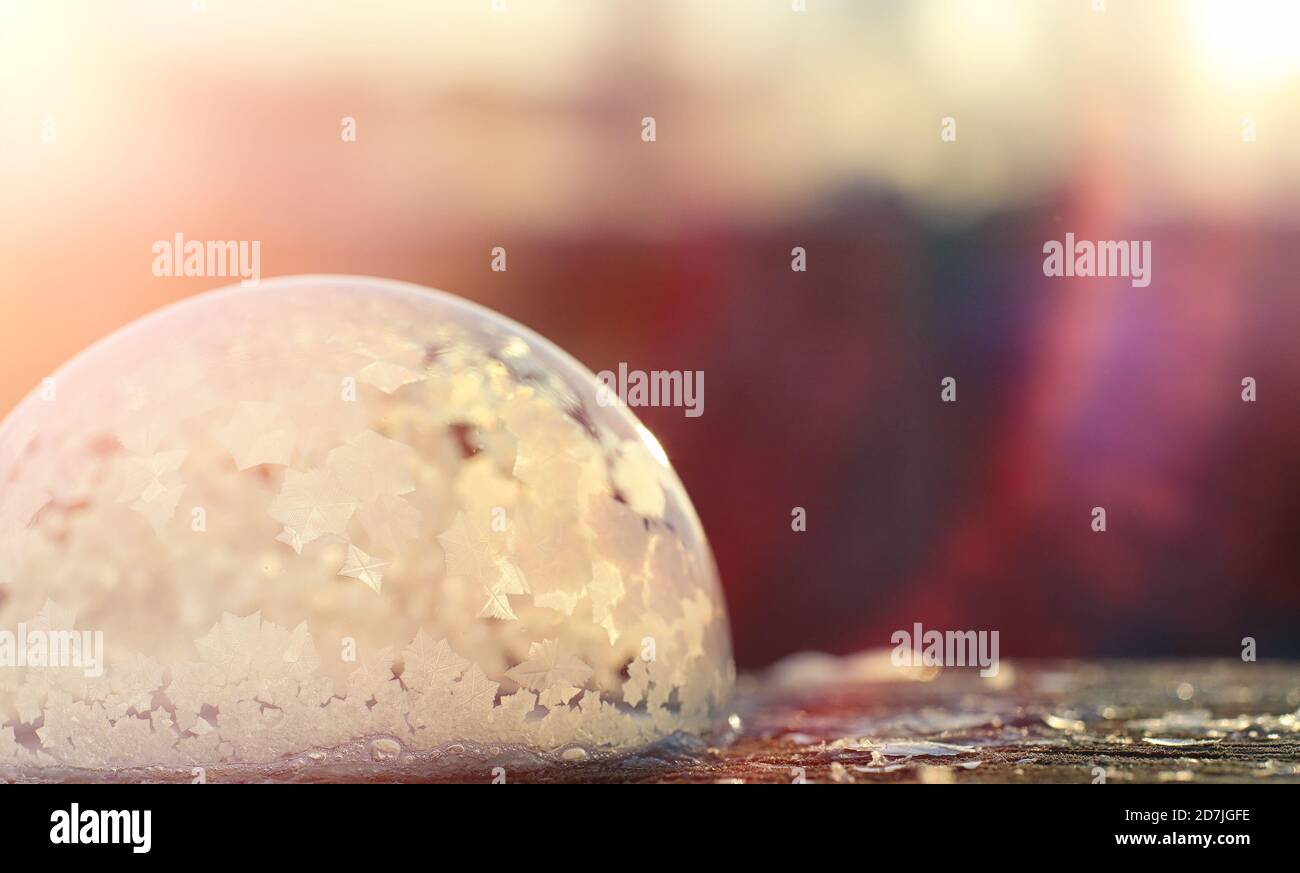 Soap bubbles freeze in the cold. Winter soapy water freezes in the air ...