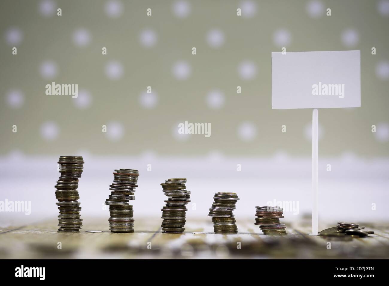 coins stacked in piles on the floor Stock Photo - Alamy