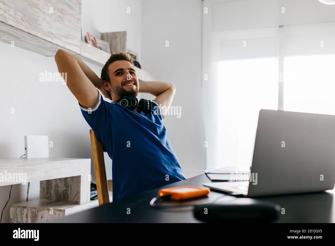 Young man sitting behind computer hi-res stock photography and images ...
