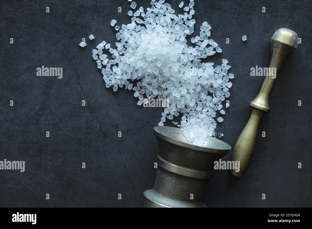 Large sea salt. Spice. Mortar and pestle for grinding Stock Photo - Alamy