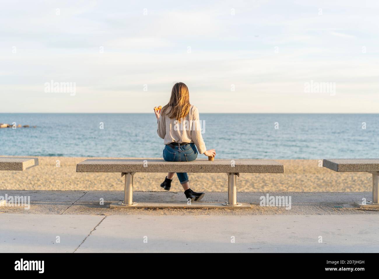 Woman sitting rear view bench hi-res stock photography and images - Alamy