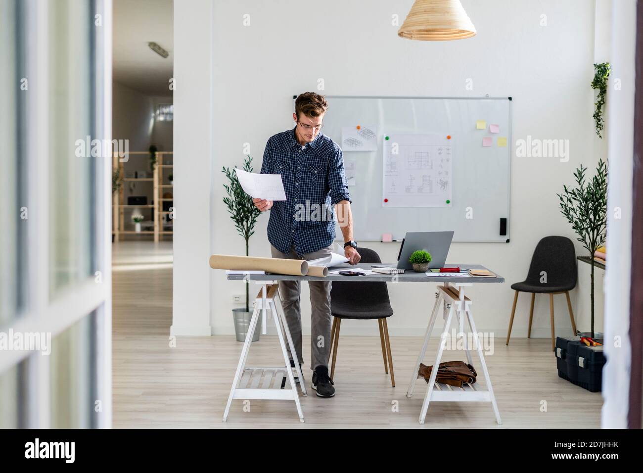 Standing while working hi-res stock photography and images - Alamy