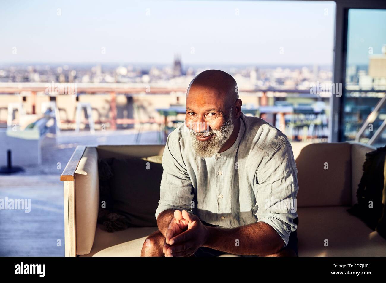 Attractive man home sitting on hi-res stock photography and images - Alamy