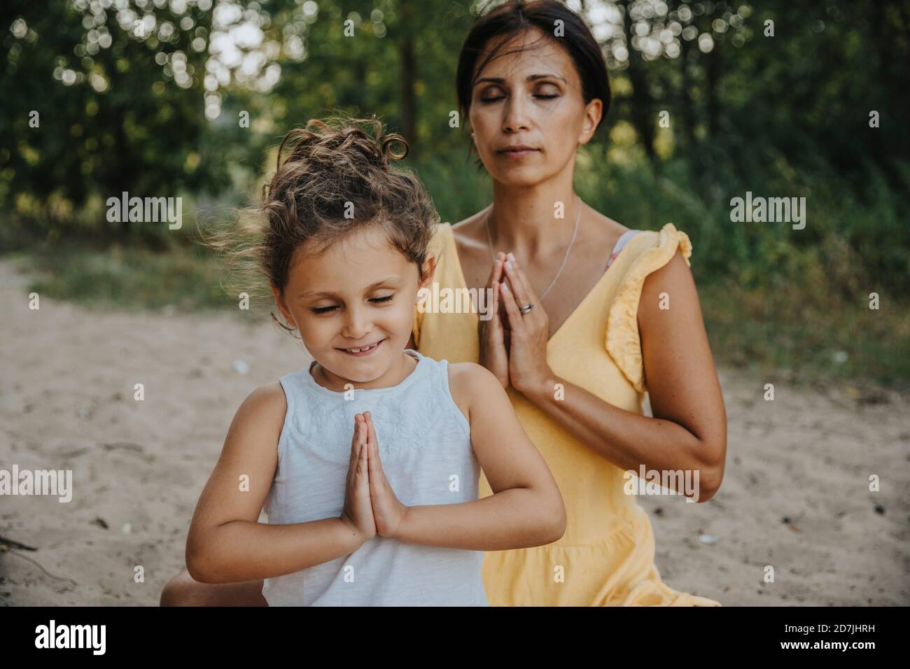 Family meditating hi-res stock photography and images - Alamy