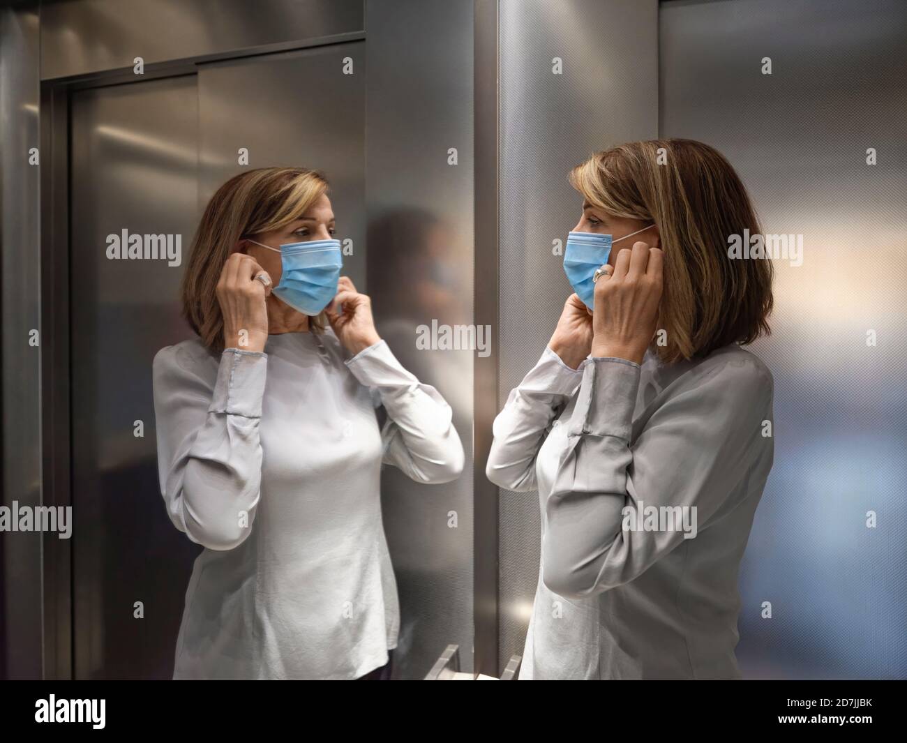 Business people standing in elevator hi-res stock photography and ...