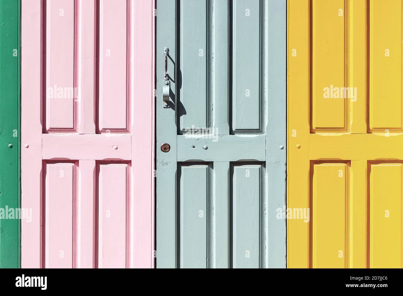 building exterior with colorful wooden gate Stock Photo - Alamy