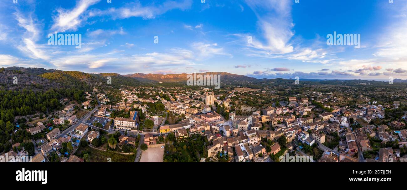 Spain, Mallorca, Calvia, Helicopter panorama of old town at dusk with ...