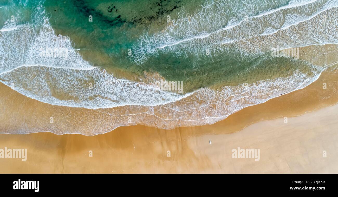 Aerial view of edge of sandy coastal beach Stock Photo - Alamy