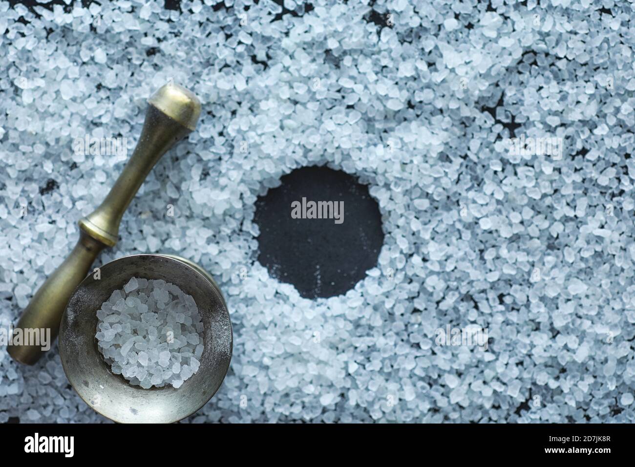 Large sea salt. Spice. Mortar and pestle for grinding Stock Photo - Alamy