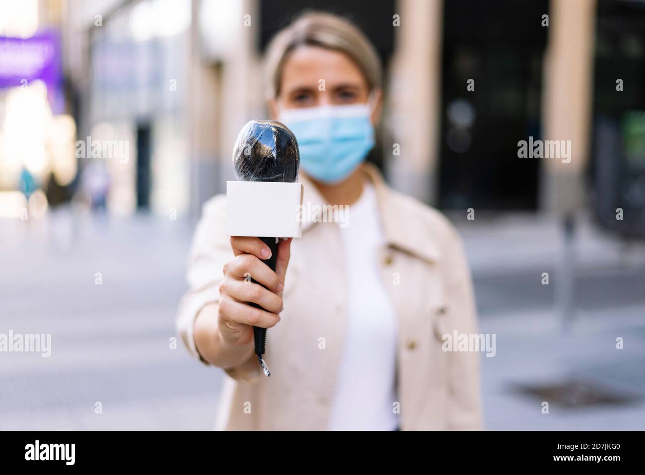Female street microphone hi-res stock photography and images - Alamy