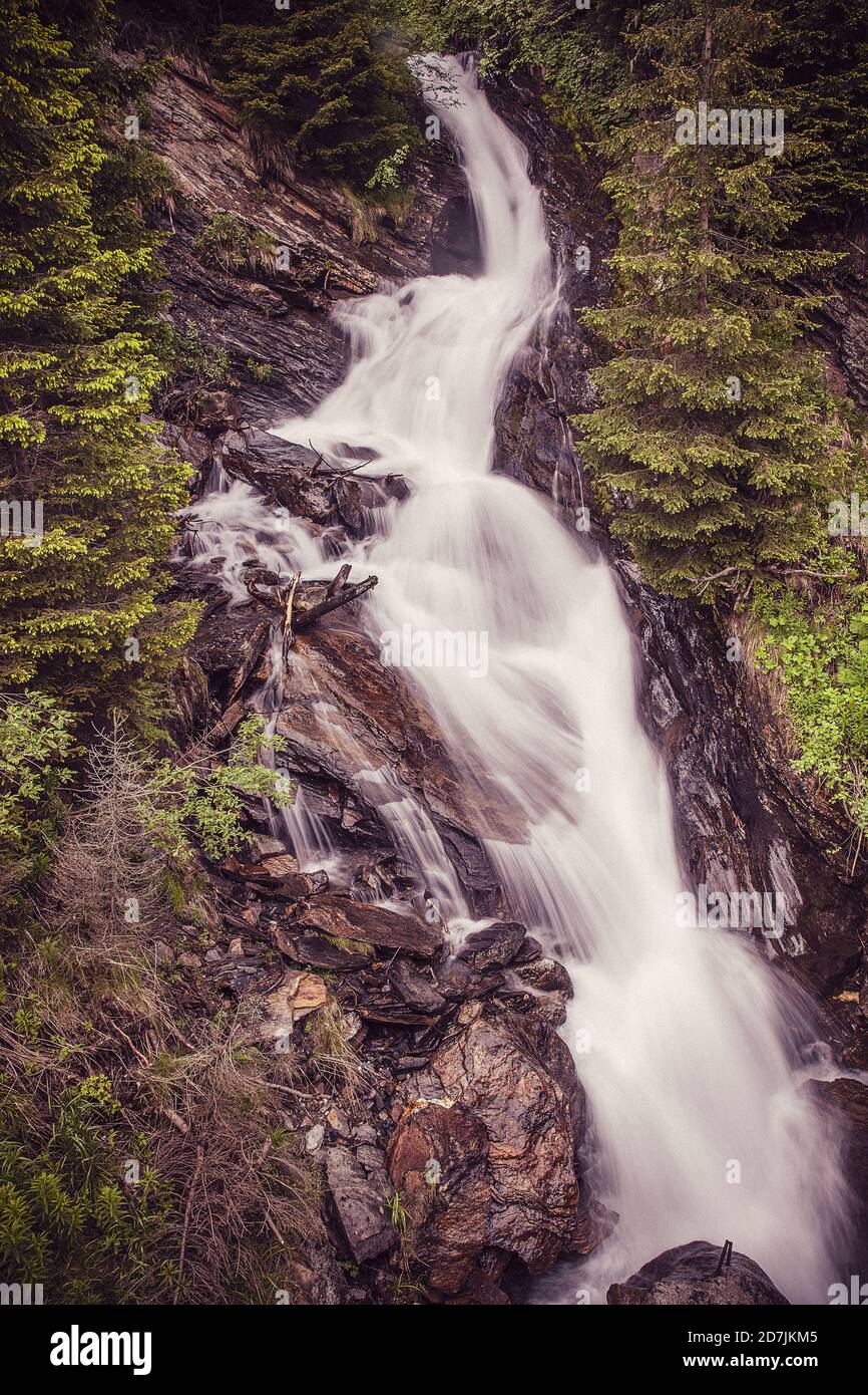 Long exposure of waterfall splashing in Central Eastern Alps Stock ... Long exposure of waterfall splashing in Central Eastern Alps Stock ...