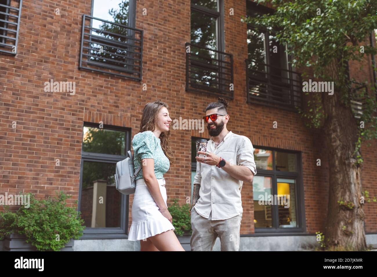 Positive young couple talking smiling hi-res stock photography and ...