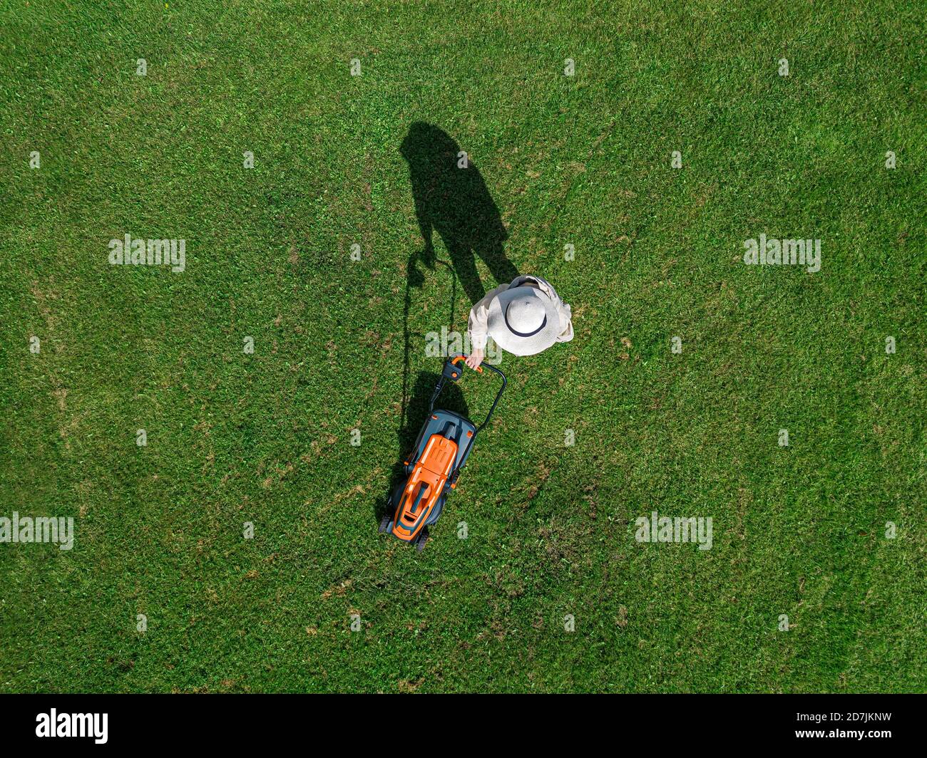 Woman pushing lawn mower hi-res stock photography and images - Alamy