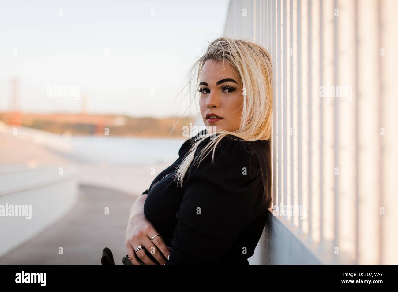 Woman Leaning Against Wall