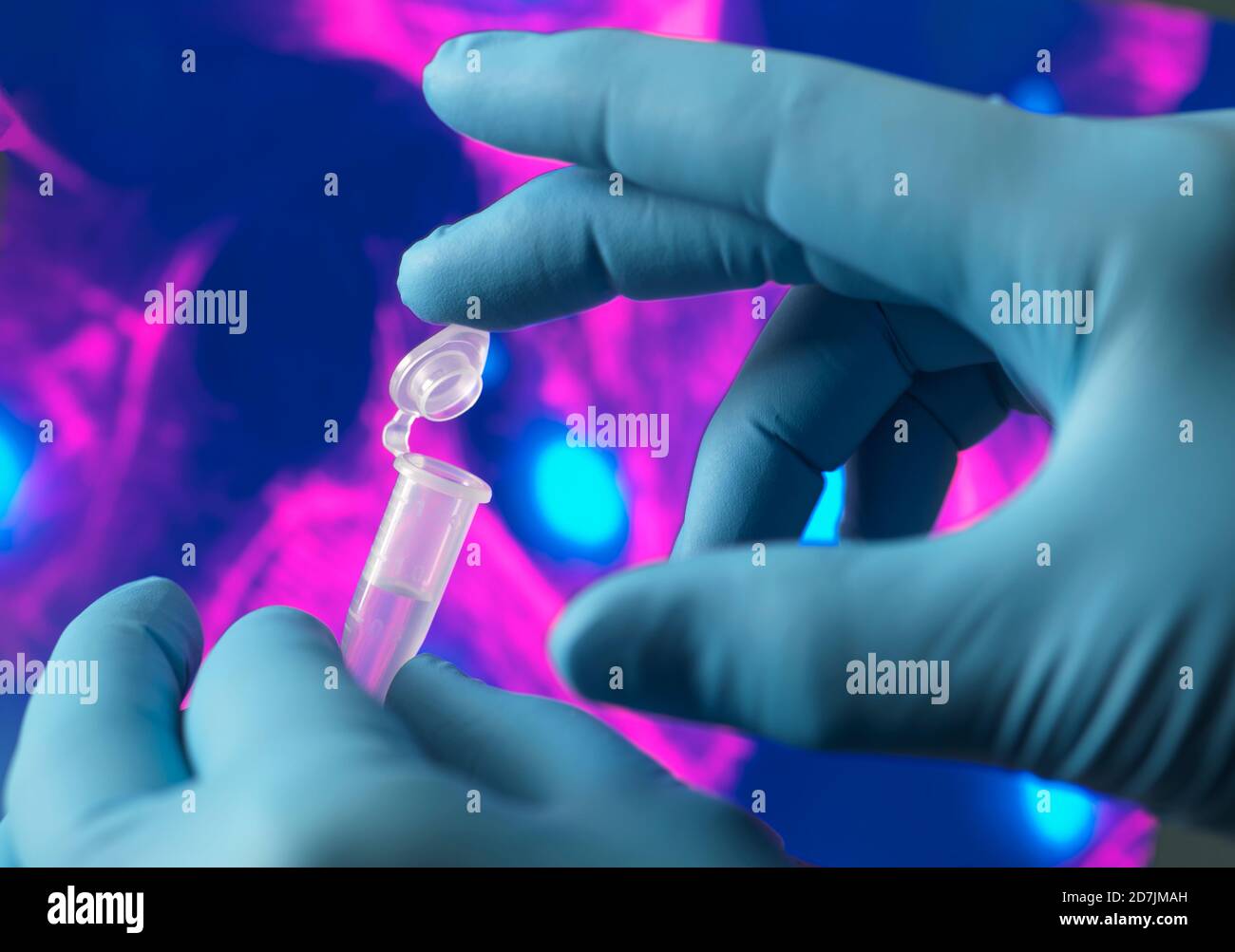Hand of scientist handling medical vial Stock Photo - Alamy