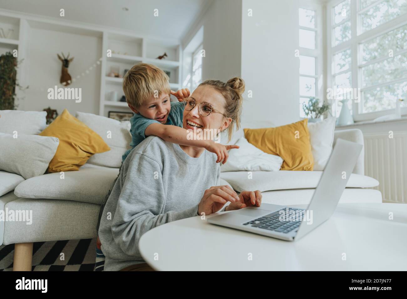 Child behind laptop hi-res stock photography and images - Alamy