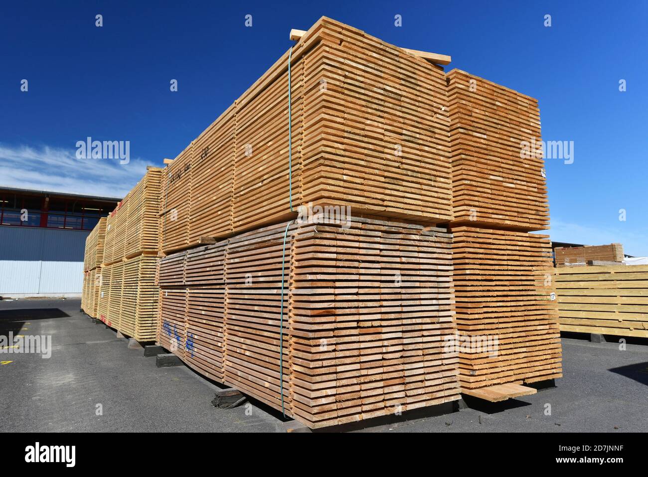 Planks stacked in lumberyard Stock Photo - Alamy