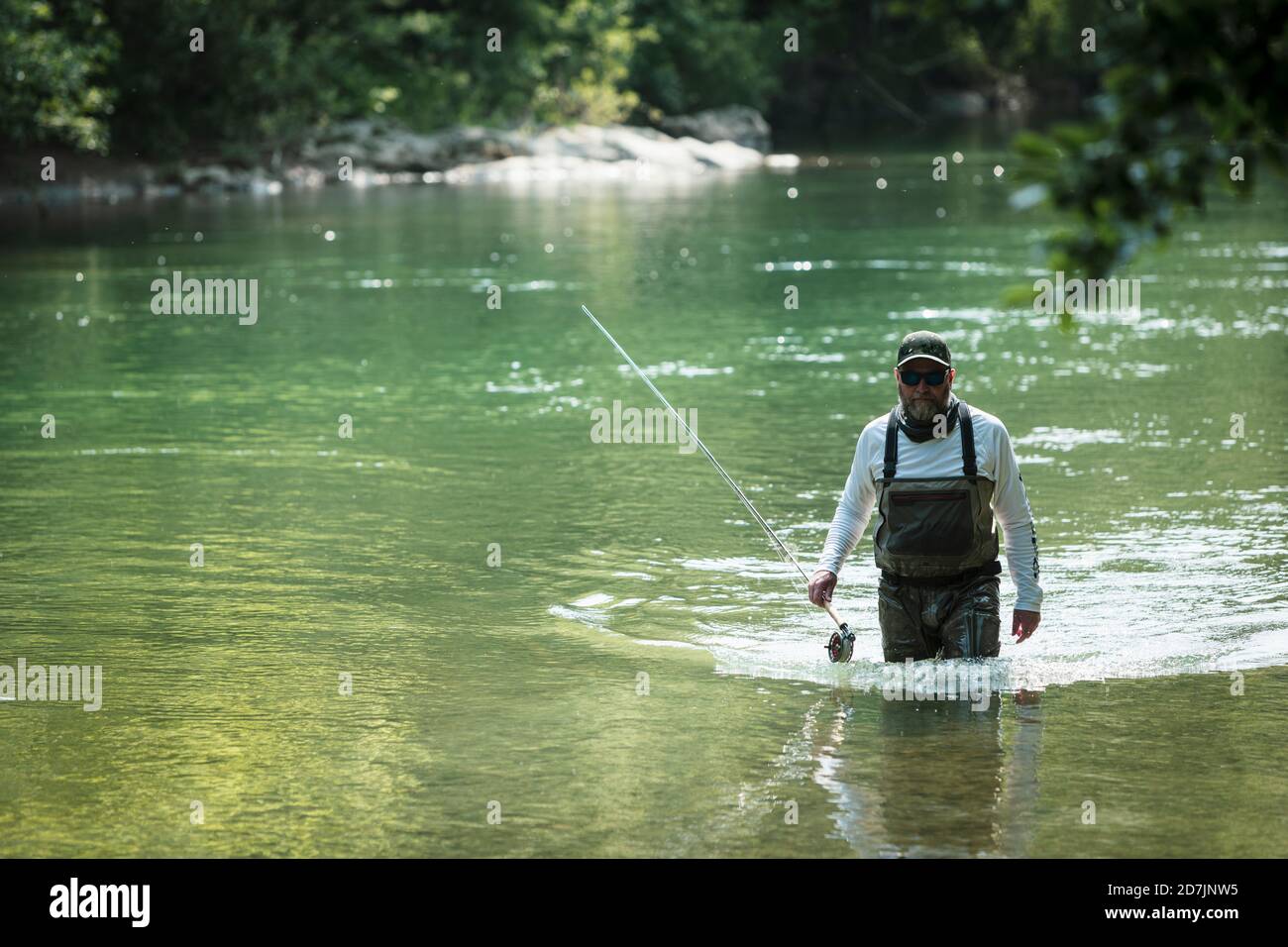 Man wading through water hi-res stock photography and images - Alamy