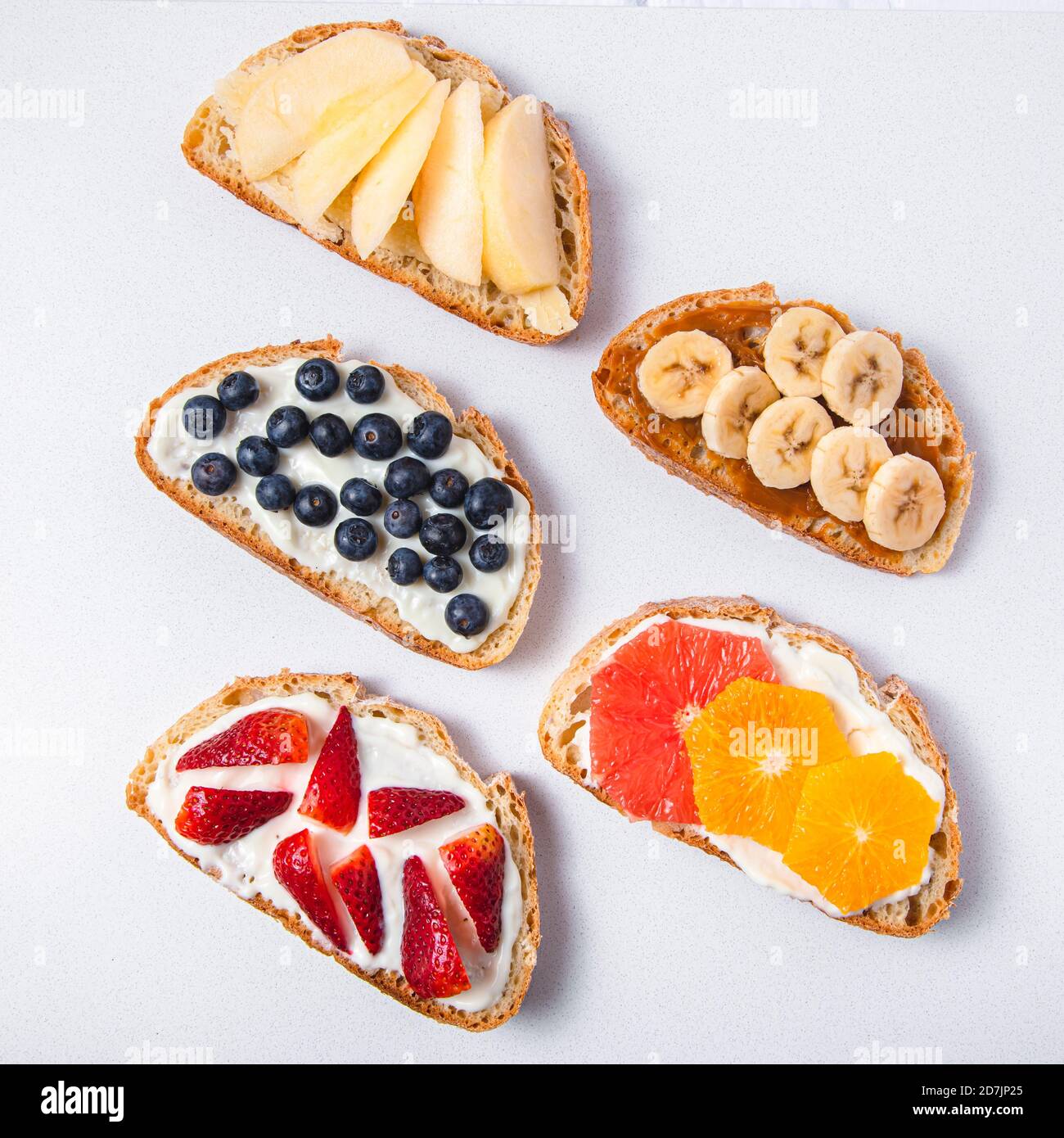 Studio shot of five slices of bread with fresh fruits Stock Photo - Alamy