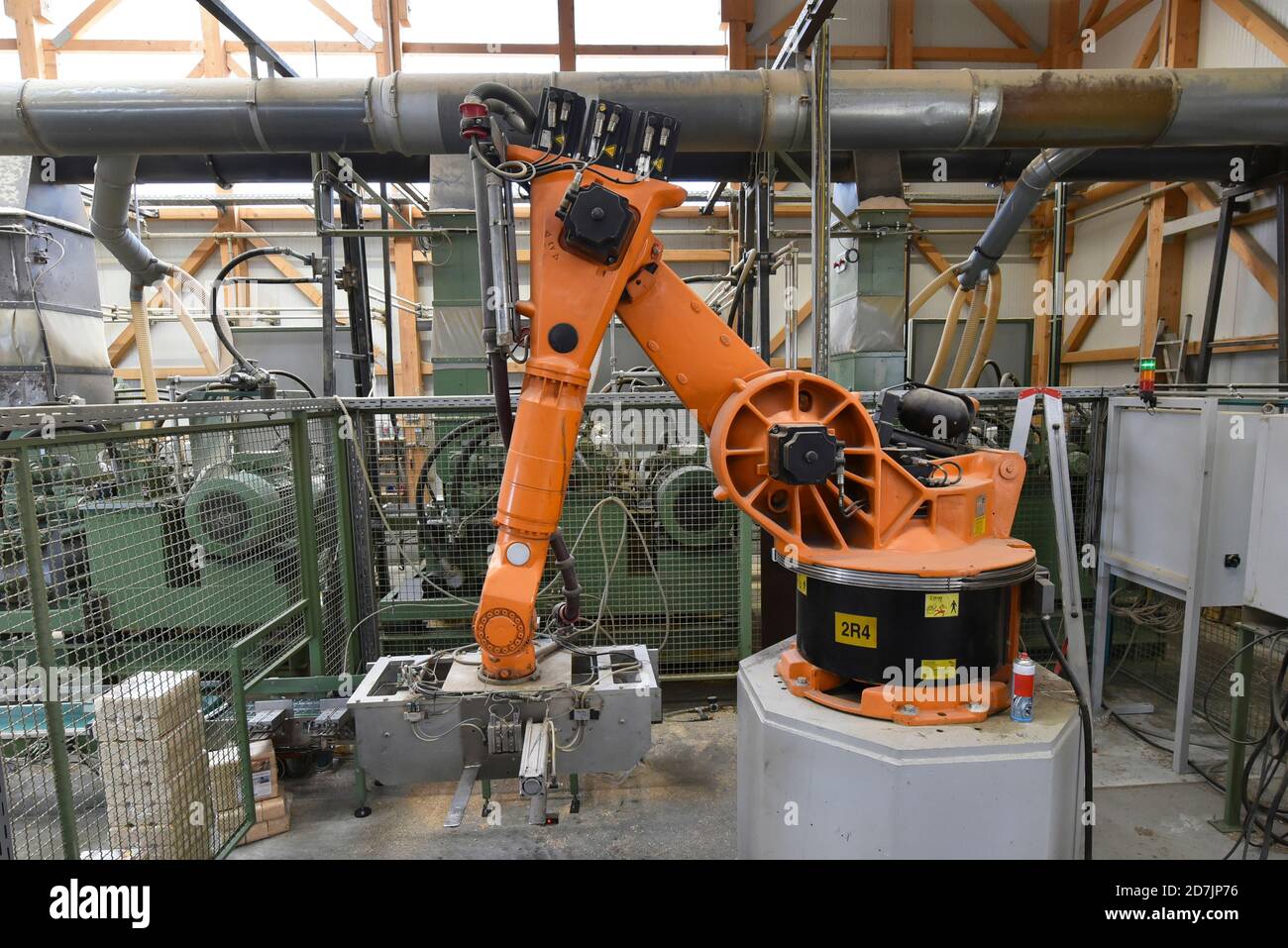Robotic arm operating in modern lumberyard Stock Photo - Alamy