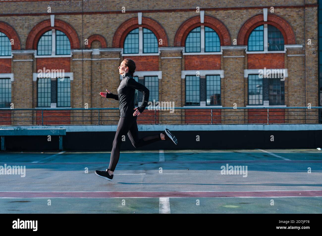 Full woman sport running in the city hi-res stock photography and ...