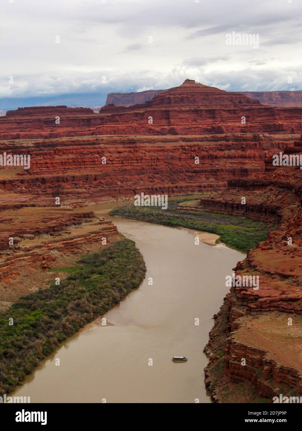The Colorado River, were it cut a canyon through the red colored cliffs ...