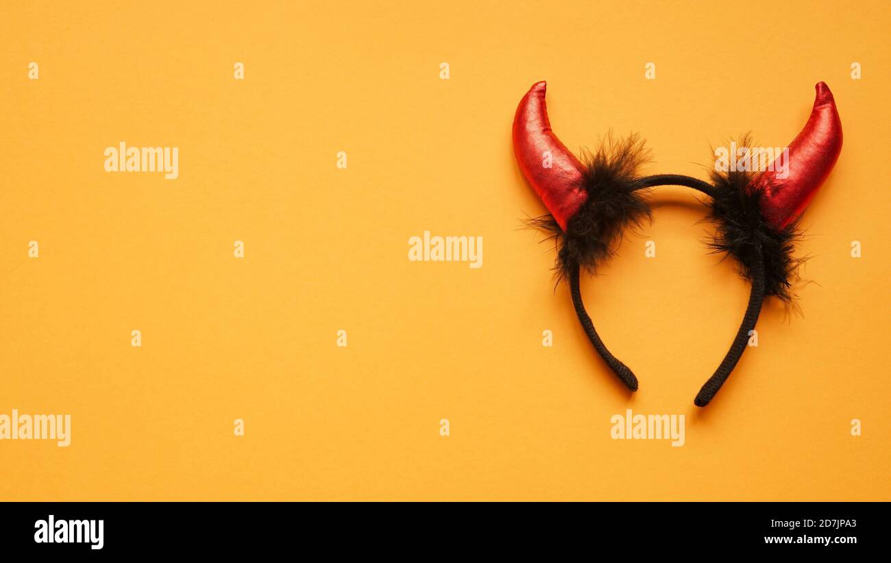 Red devil horns head hoop on orang background. Accessory for Halloween ...