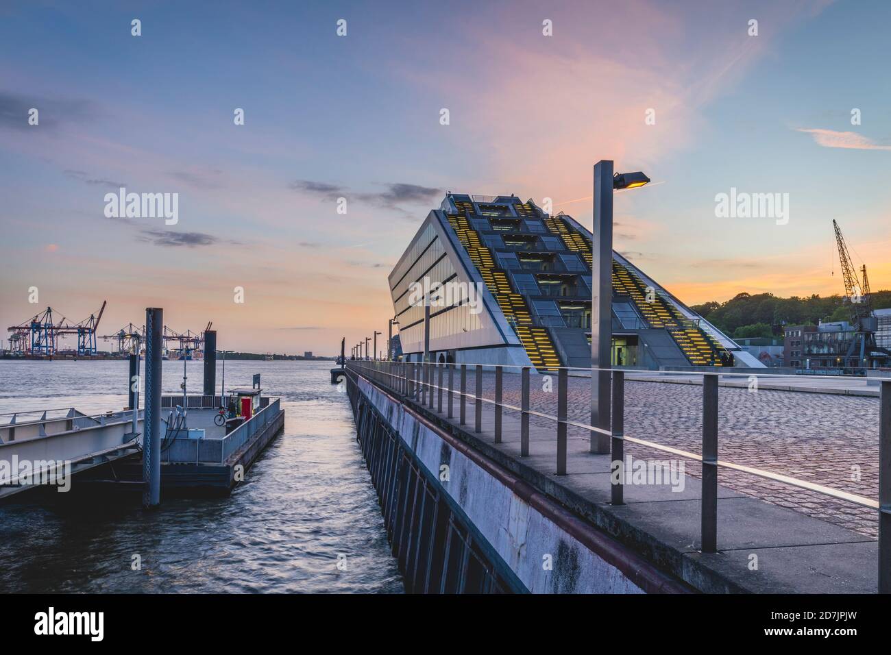 Germany, Hamburg, Illuminated modern office building near dock at ...