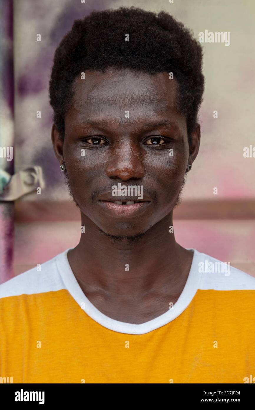 Man standing against container Stock Photo - Alamy