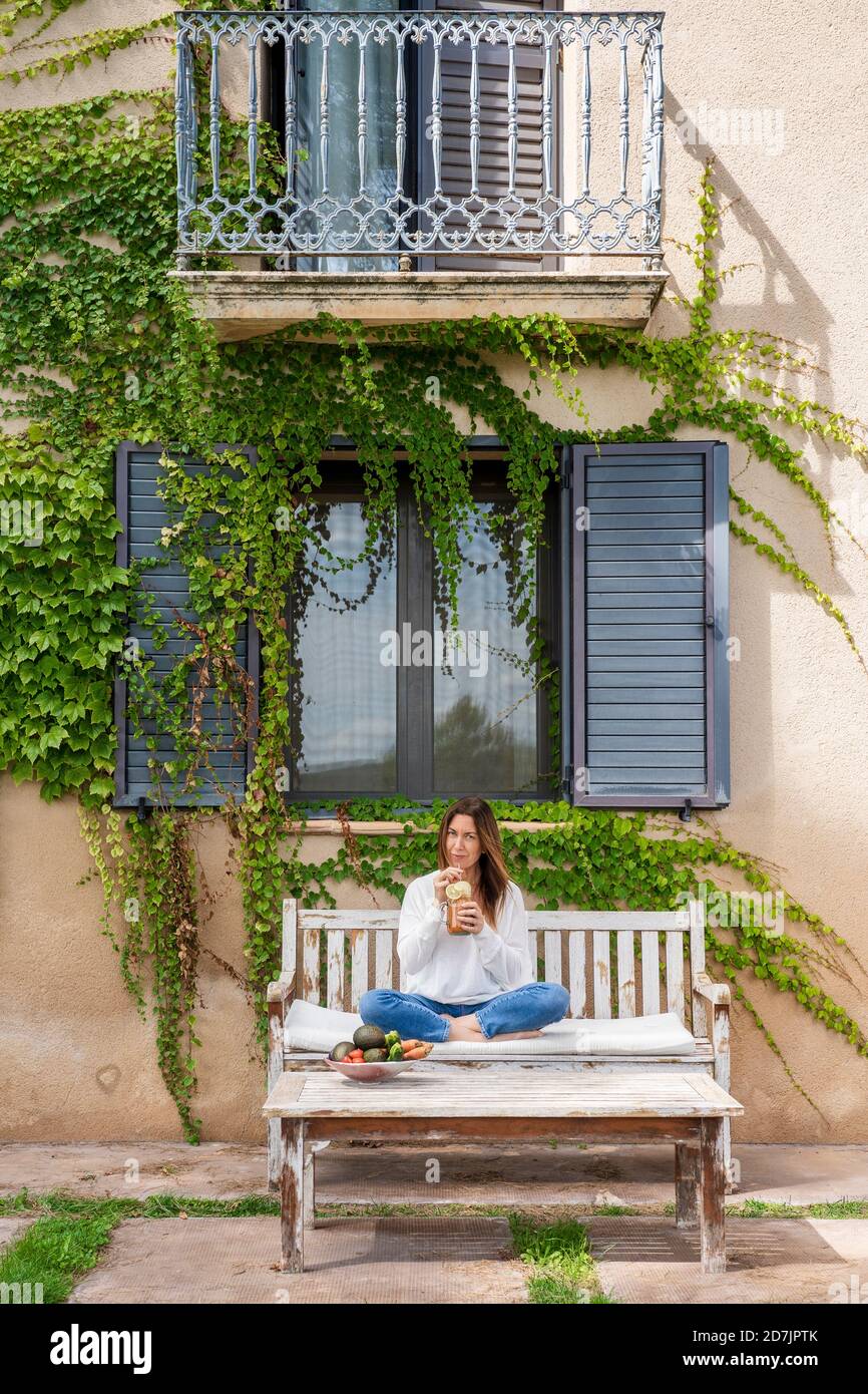 Mature woman looking back at house hi-res stock photography and images ...