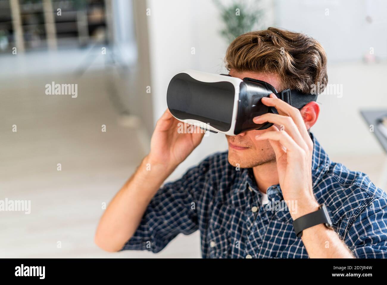 Architect using visual reality eyeglasses at office Stock Photo - Alamy