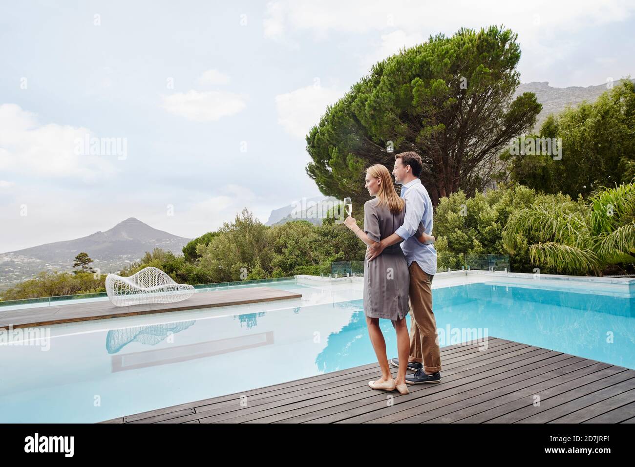 Man standing near swimming pool hi-res stock photography and images - Alamy