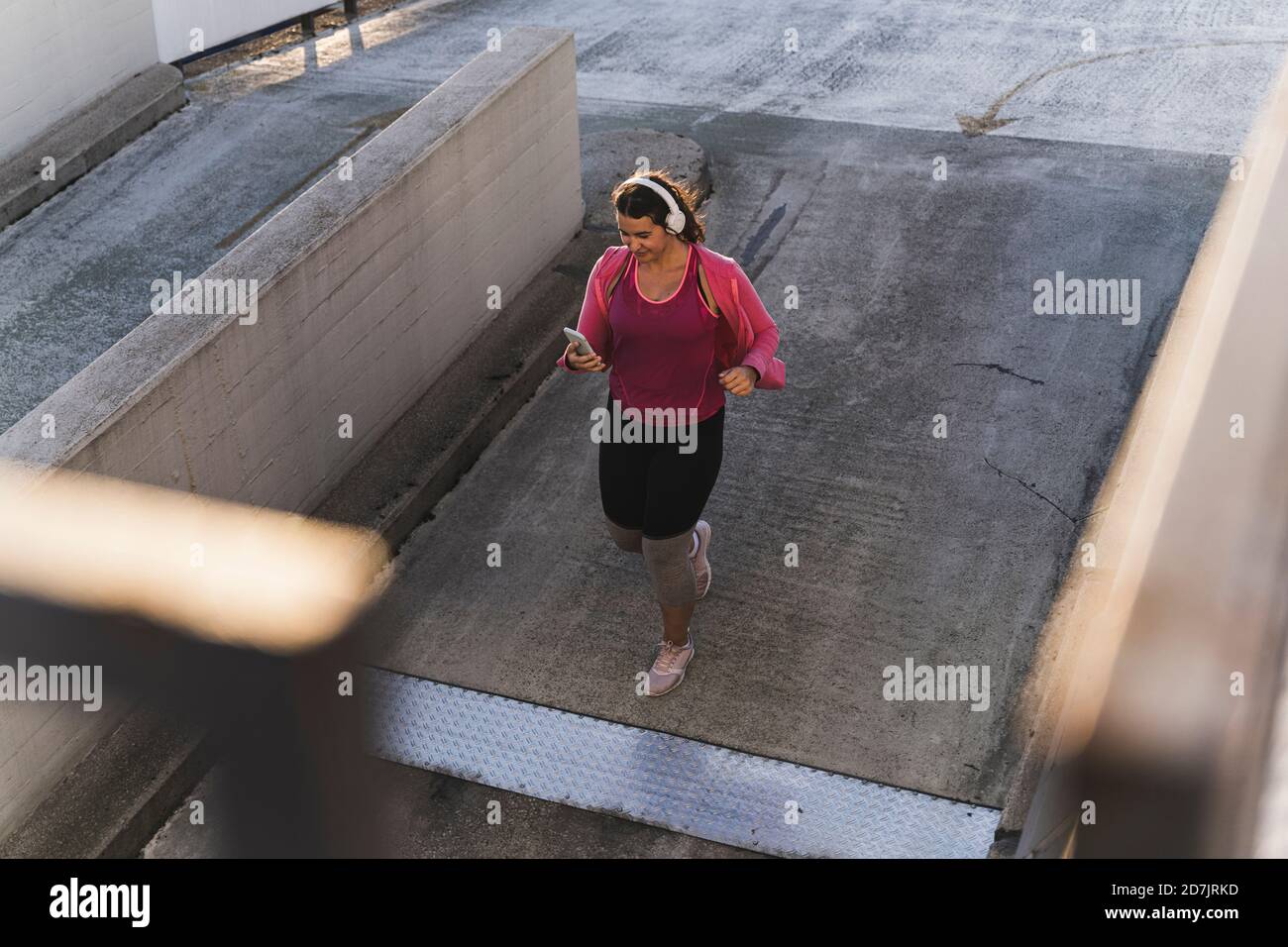 Running headphones woman wireless hi-res stock photography and images ...