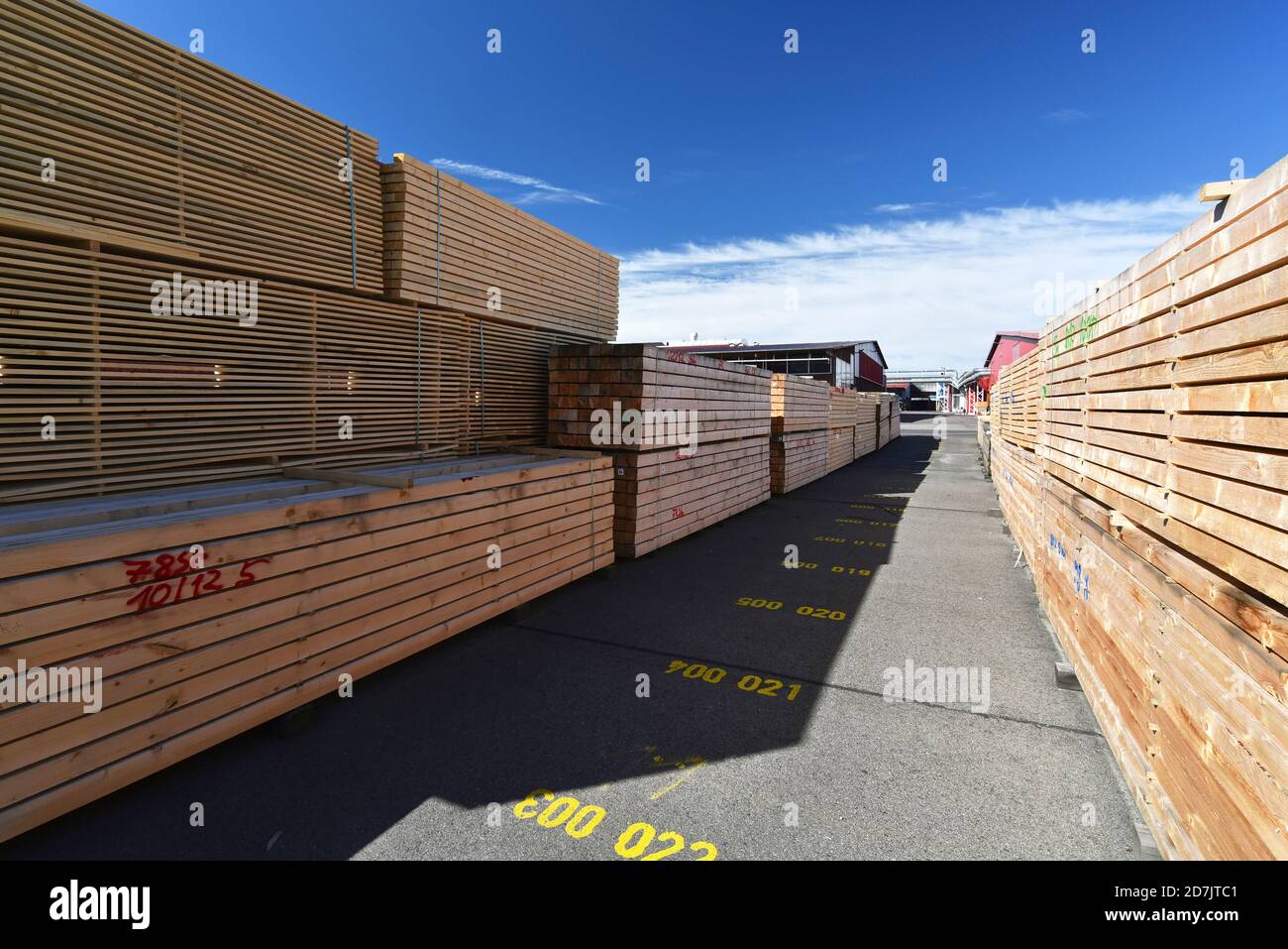 Planks stacked in lumberyard Stock Photo - Alamy