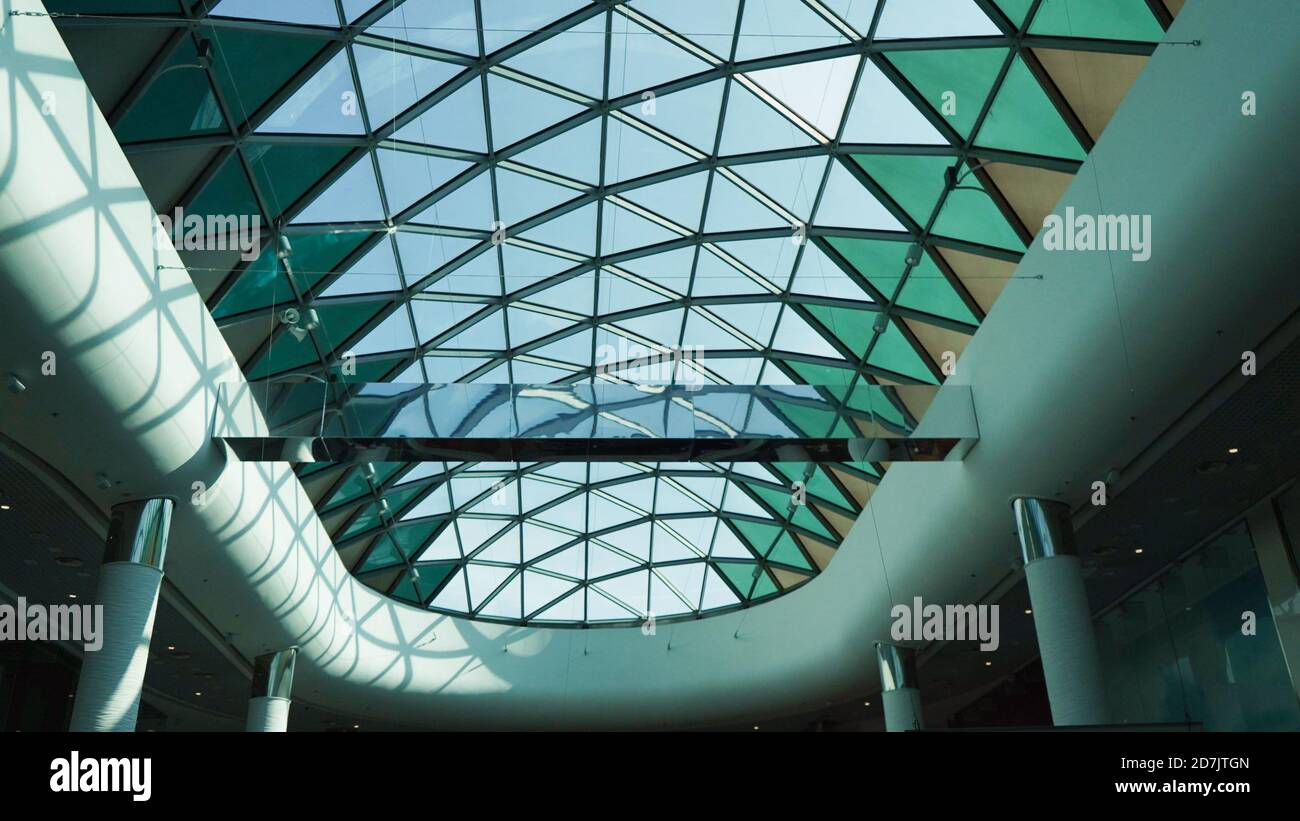 Modern design of the glass roof of the shopping center, inside view ...