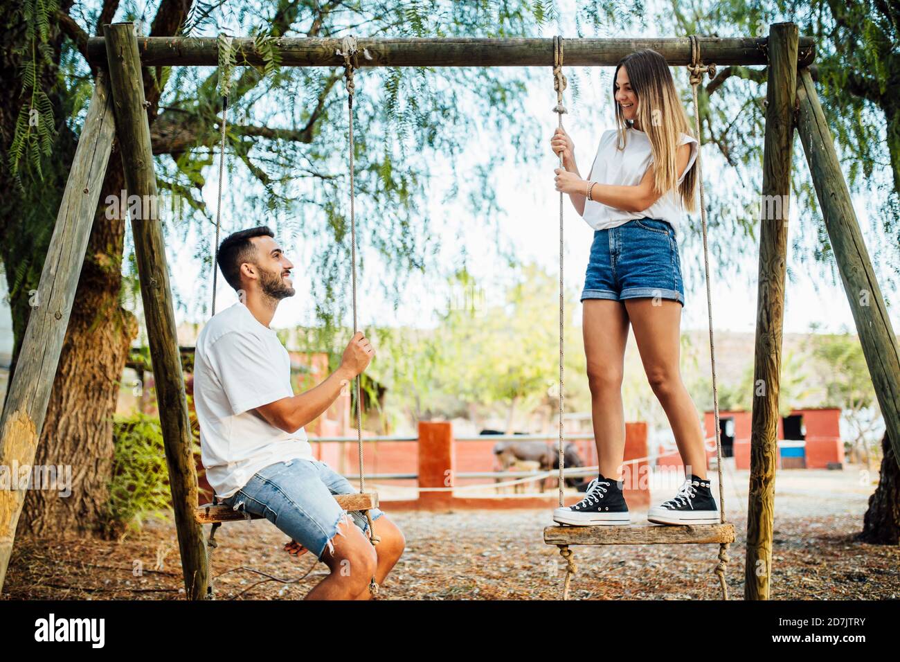 Couple on swing hi-res stock photography and images - Alamy