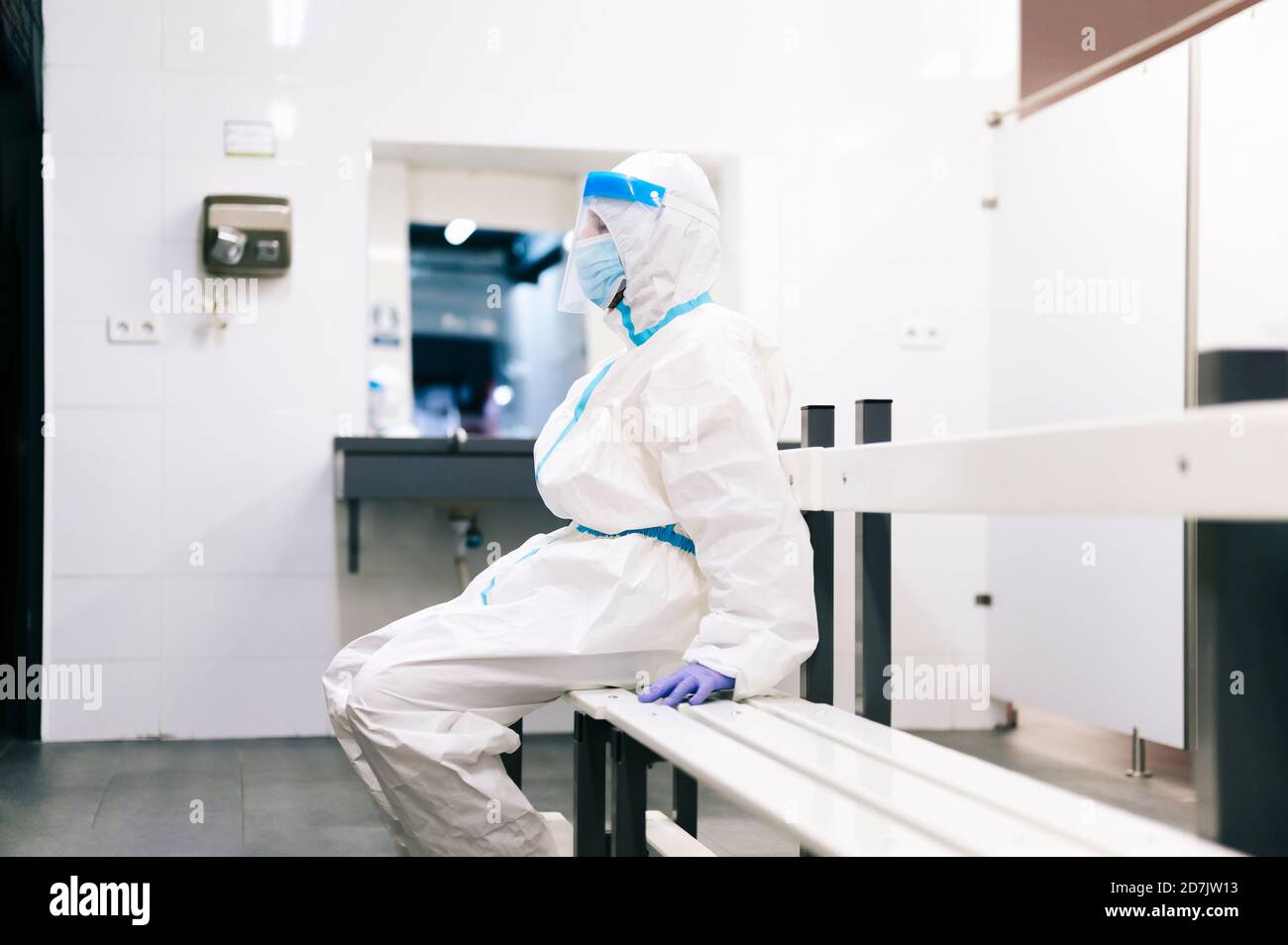 Healthcare man sitting on bench in medical room at hospital Stock Photo ...