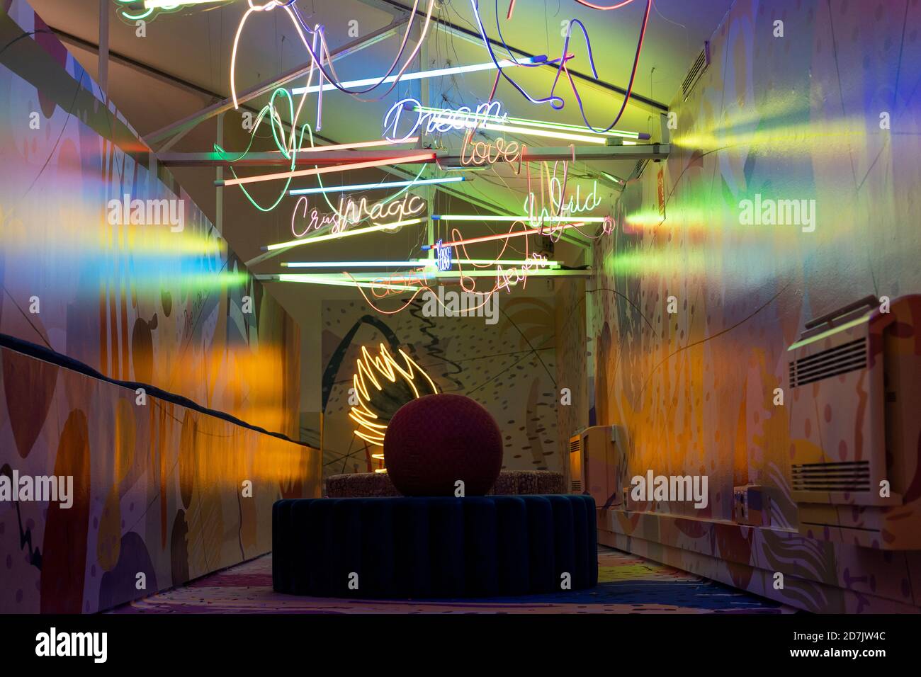 Room illuminated by colorful neon signs Stock Photo - Alamy