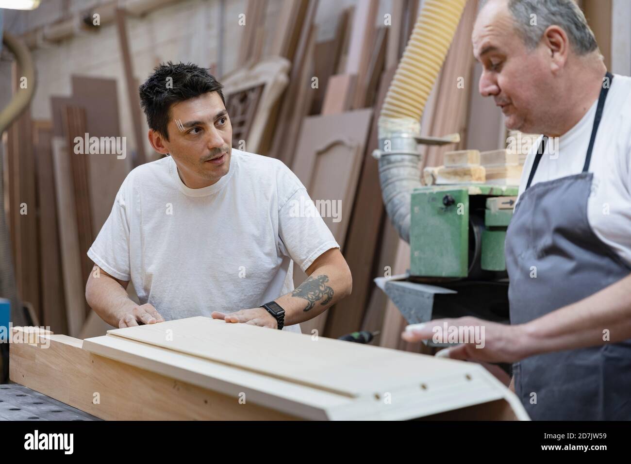 Two men standing workbench hi-res stock photography and images - Alamy