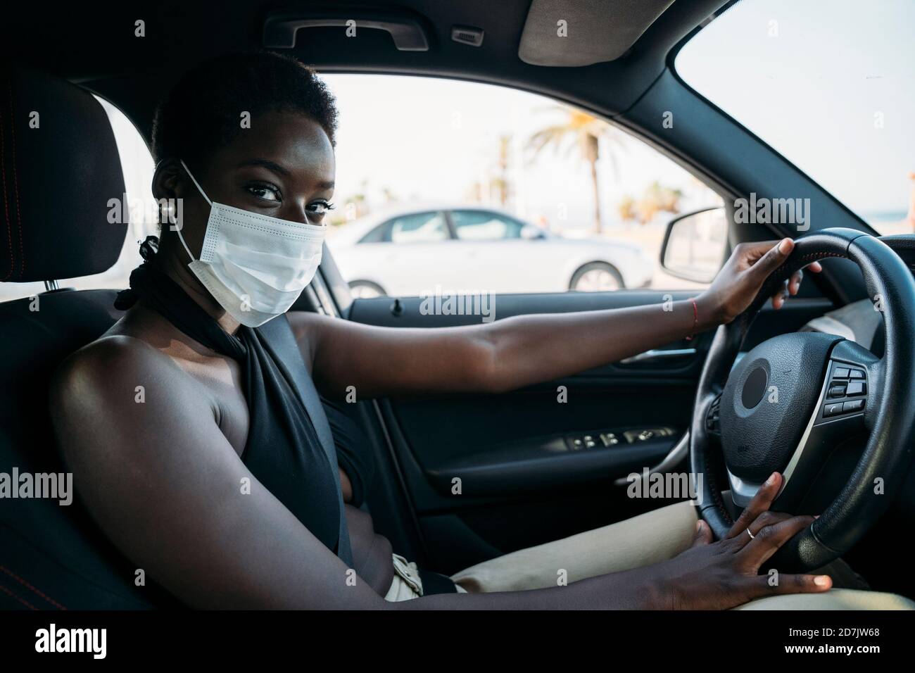 Woman with protective face mask driving car Stock Photo - Alamy Woman with protective face mask driving car Stock Photo - Alamy