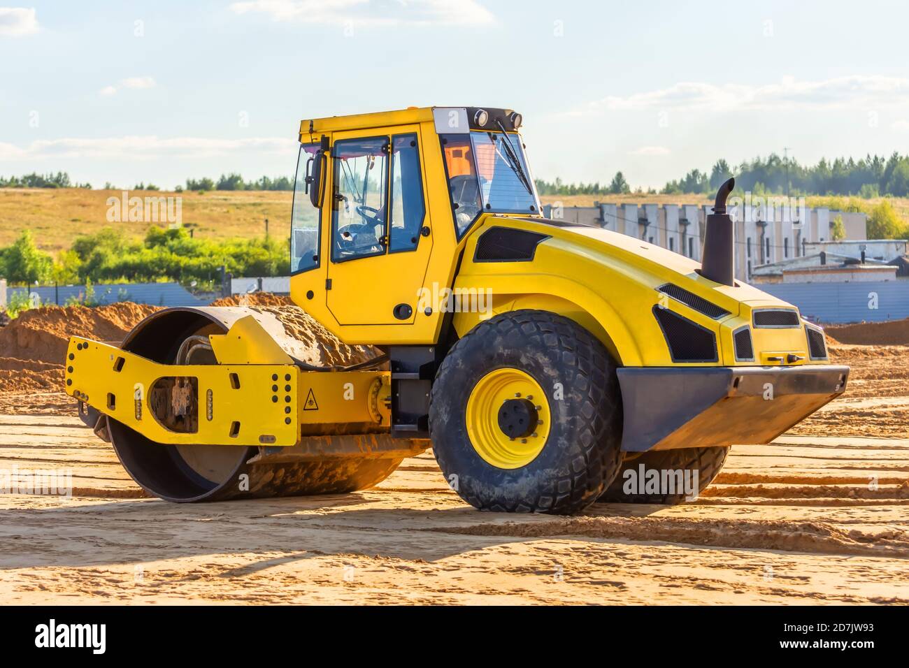 Skating rink for laying asphalt on sealing sand is compacted during the ...