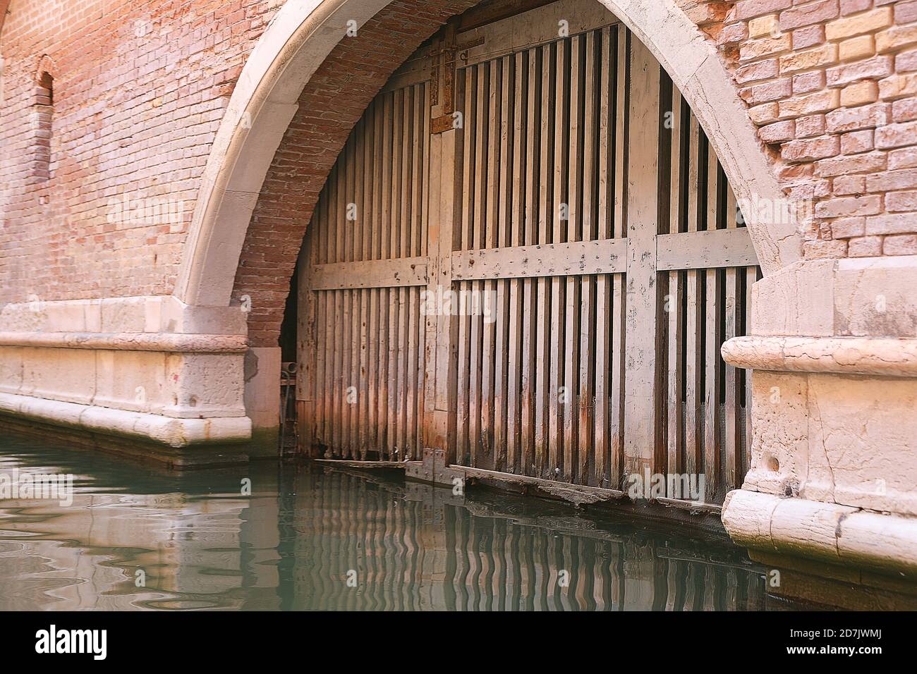 Wooden gate on the navigable canal in Venice during high tide Stock ...